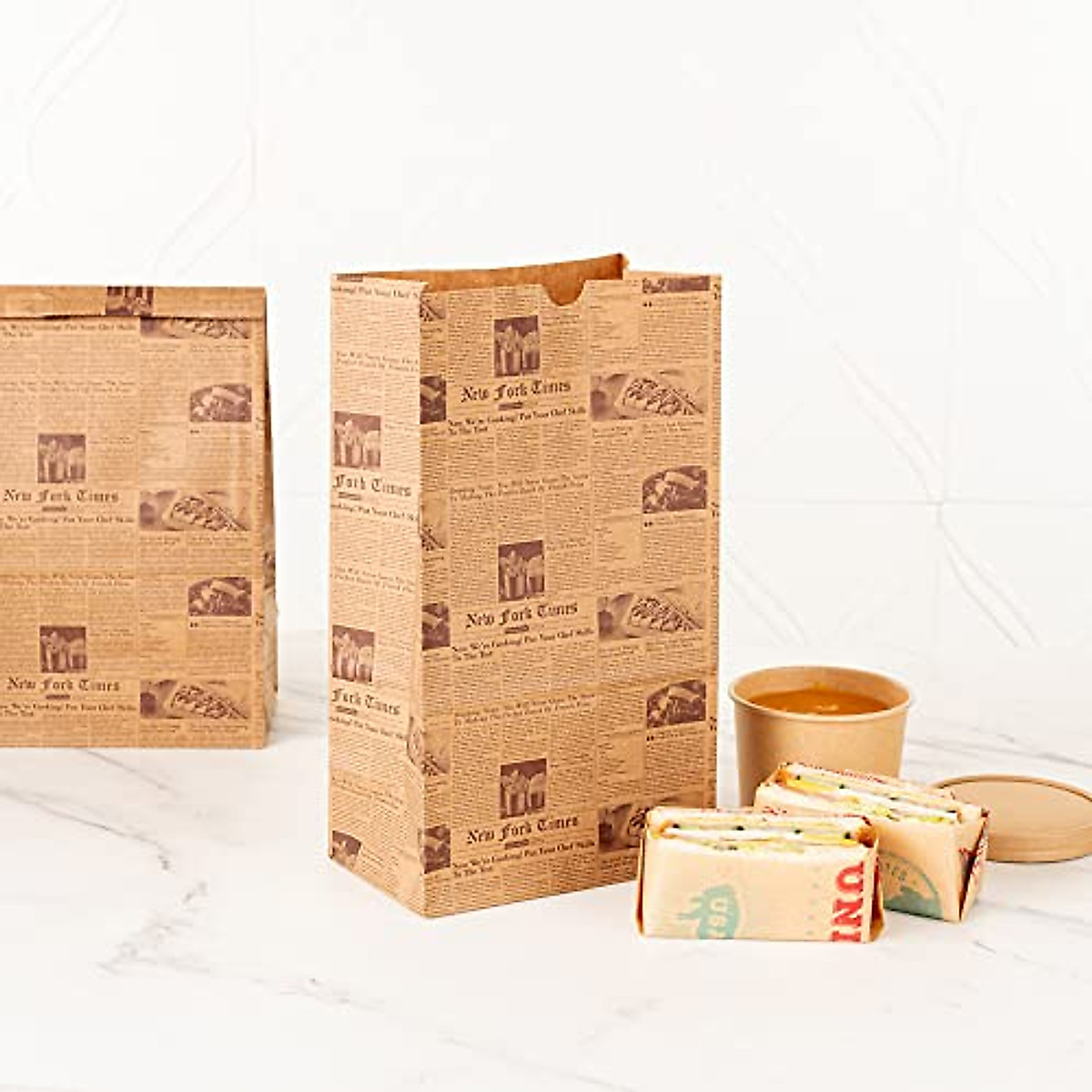 Restaurantware Bag Tek 12 Lb Disposable Lunch Bags 100 Sturdy Take Out Bags - Flat Bottom Microwavable Kraft Newsprint Design Paper Bags Freezable Great For Restaurants Cafes And Bakeries