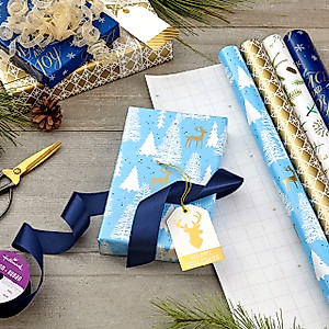 Hallmark Holiday Wrapping Paper Bundle with Cut Lines on Reverse, Quirky Christmas (Pack of 4, 120 sq. ft. ttl) Yeti, Santa, Penguin, Snowflakes, Blue, Gold