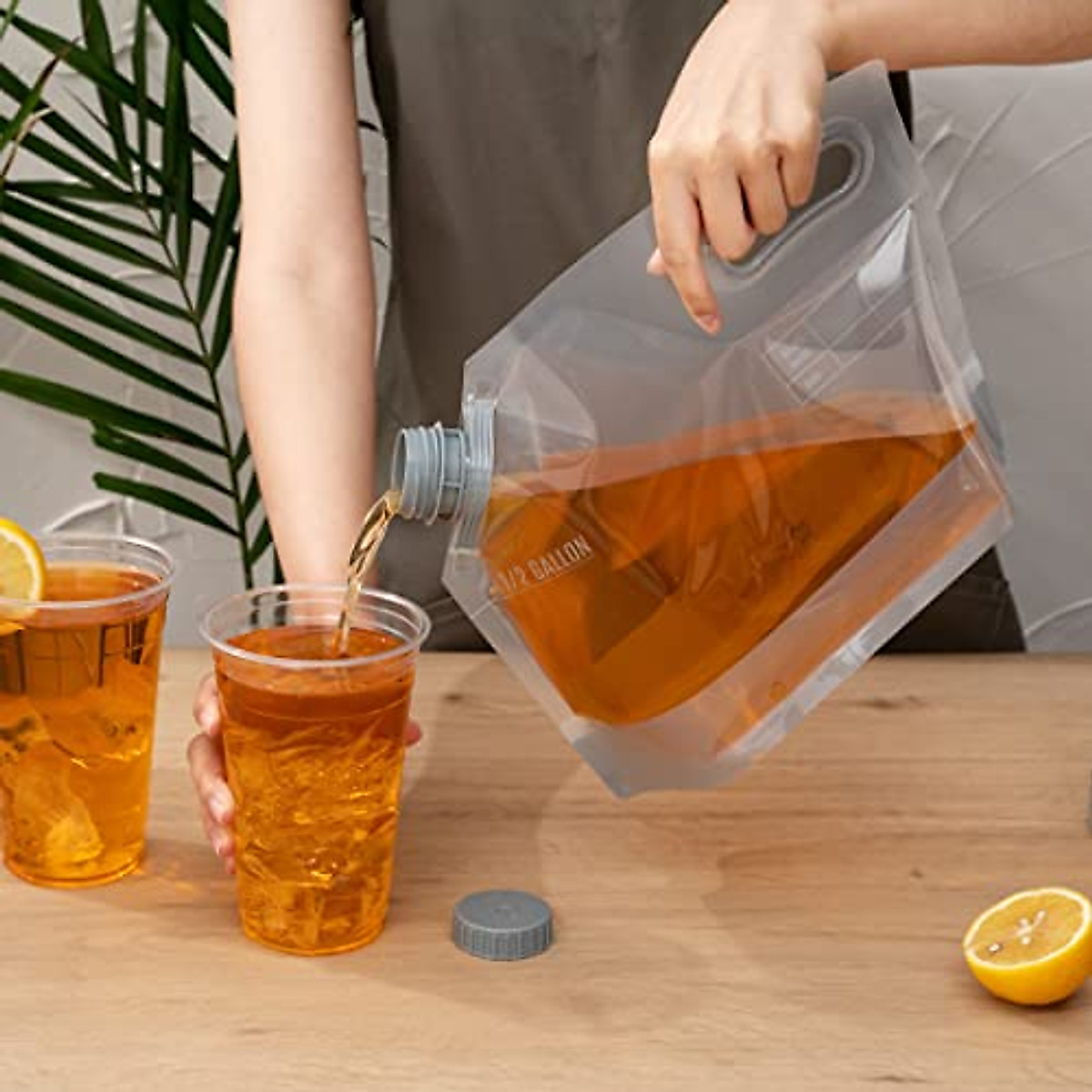 Restaurantware Cater Tek 1/2 Gallon Water Containers 10 Drink Bags - Collapsible Includes Tamper-Evident Caps Clear Plastic Beverage Bags For Catered Events Camping or Hiking Durable Handle