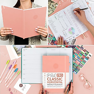 GoGirl Planner PRO - Undated Horizontal Layout Weekly Planner and Organizer + Budgeting and Expense Tracking Pages, Goals Journal & Agenda, 7" x 10" Hardcover, Lasts 1 Year - Peach Pink