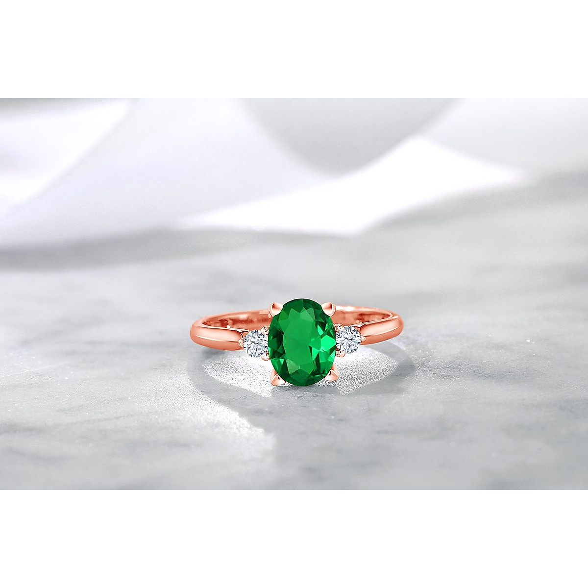Gem Stone King 10K Rose Gold Green Simulated Emerald and White Created Sapphire 3-Stone Ring For Women (1.10 Cttw, Available In Size 5, 6, 7, 8, 9)