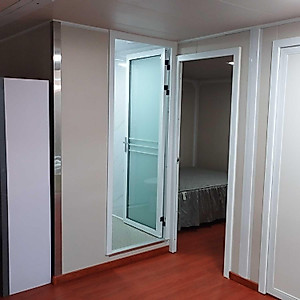 Mobile prefab Expandable Tiny Houses for Families with Restroom, Outdoor Storage. Sturdy Steel and Plastic. Suitable for Various Purposes Like Hotels, Offices etc. (19ft x 20ft)