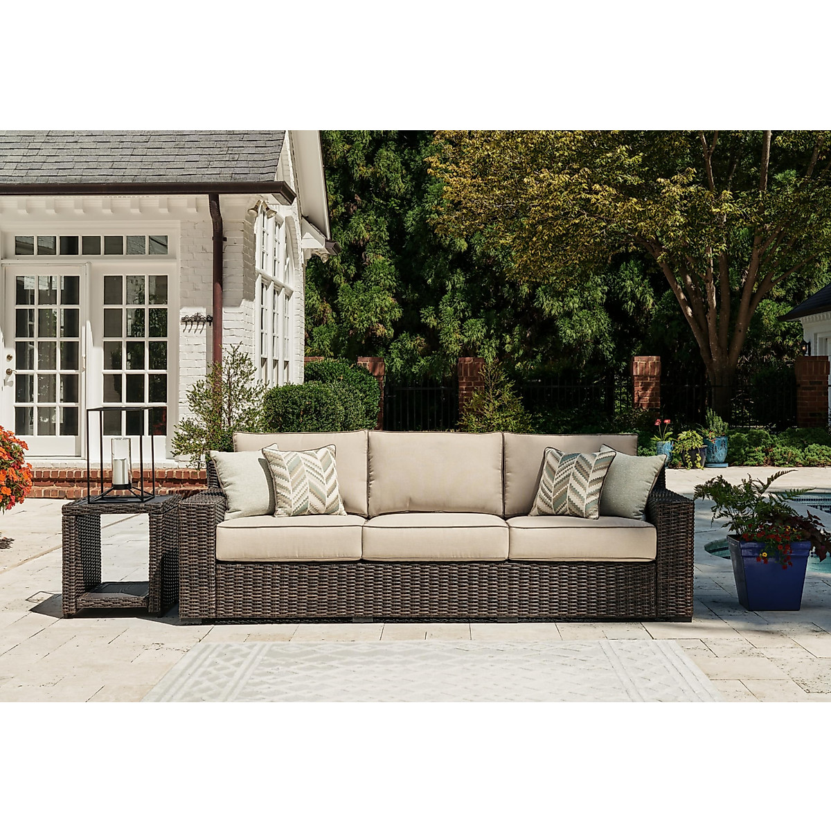Signature Design by Ashley Coastline Bay Casual Weather Resistant Outdoor Sofa with Cushion and 4 Throw Pillows, Beige & Dark Brown