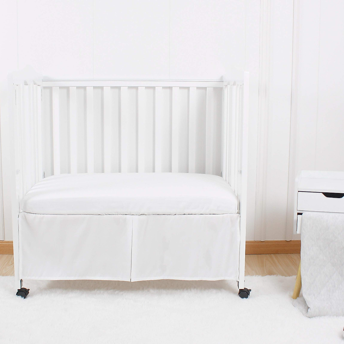 CaSaJa Mini Crib Skirt Pleated, Silk-Looking Soft Microfiber Baby Bed Skirt with Durable Platform for Mini and Portable Cribs 24" X 38", 12" Generous Drop Dust Ruffle, Machine Washable, White Color