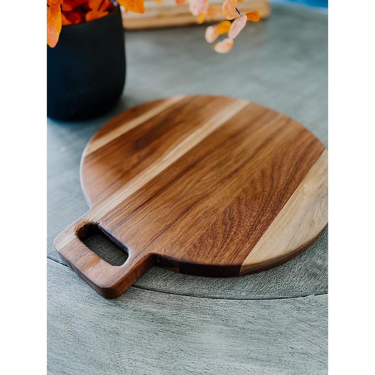 Round charcuterie serving board with handle, handmade in the USA with Walnut hardwood.