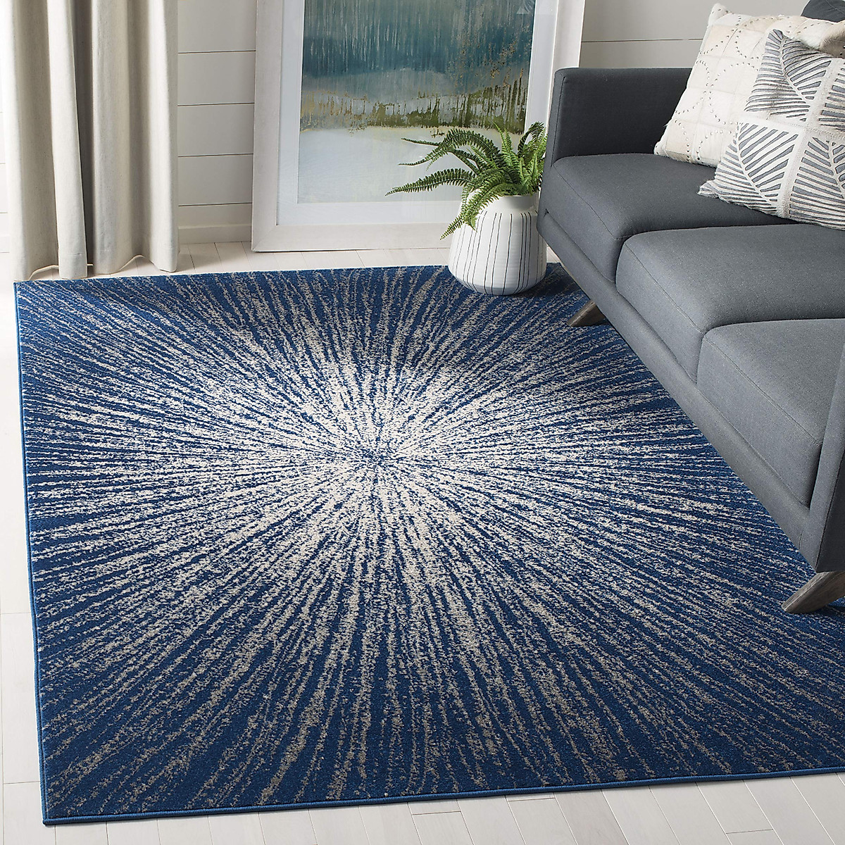 SAFAVIEH Evoke Collection Area Rug - 9' x 12', Navy & Ivory, Abstract Burst Design, Non-Shedding & Easy Care, Ideal for High Traffic Areas in Living Room, Bedroom (EVK228N)