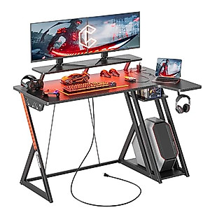 CubiCubi Gaming Desk with LED Lights & Power Outlets, 47 Inch L Shaped Carbon Fiber Surface Desk with Storage Shelves, Small Corner Computer Desk with Monitor Shelf, Black