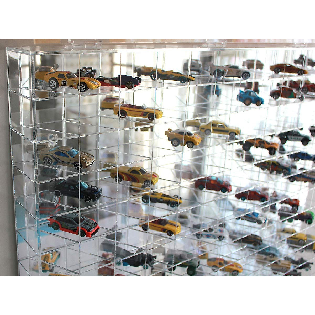 DisplayGifts Clear Acrylic Display Case for 1:64 Scale Hot Toy Cars Wheels Model Cars Display with 144 Compartments in 45 Degree Angle, Clear, UV Protect 22.5 X 30.4 X 3 Inches, Wall Mounted Storage