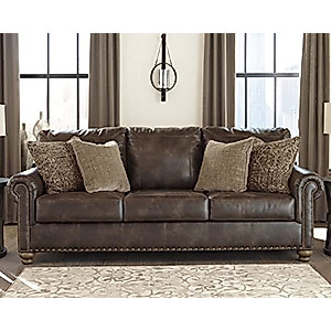 Signature Design by Ashley Nicorvo Traditional Faux Leather Sofa with Gold Nailhead Trim, Brown