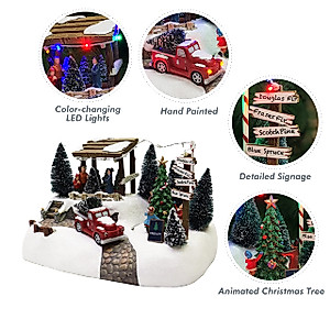 MOMENTS IN TIME Christmas Village Building, Tree Lot with LED Lights and Christmas Music - Battery Operated (not Included) (Optional 4.5V Adapter not Included) (6.9" H x 10.8" W x 7.7" D)