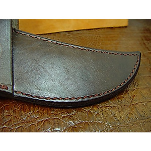 Custom-made Cross Draw Knife Sheath for the Buck Kalinga 401 Knife. The Sheath Is Made Out of 10 Ounce Water Buffalo Hide Leather. The 10 oz. Leather is Dyed Dark Brown. The Sheath Also Has a Strap for Extra Security of Your Knife From Falling Out. The Sh