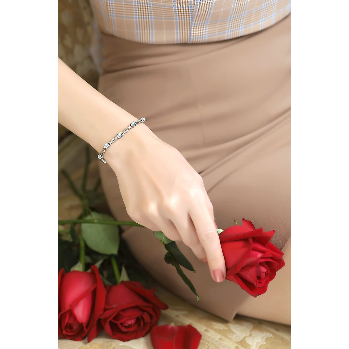 B. BRILLIANT Sterling Silver Aquamarine and White Topaz Oval-Cut Swirl Tennis Bracelet