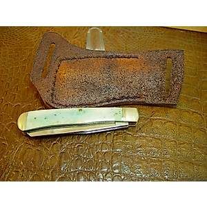 Custom Right-hand Cross Draw Trapper Style Folding Knife Sheath. Made Out of 10 Ounce Buffalo Hide Leather. Dyed Light Brown Sheath Only Knife Not Included.