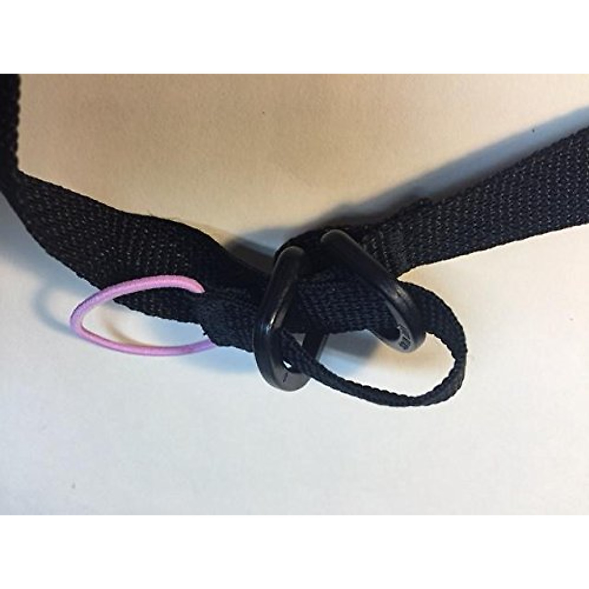 Carrier strap for single or multiple pairs of skis, poles, boots or snowboards