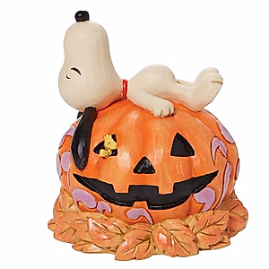 Enesco Peanuts by Jim Shore Halloween Snoopy Laying on Carved Pumpkin Figurine, 5.5 Inch, Multicolor