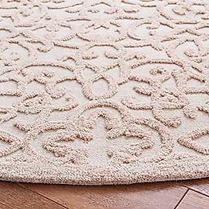 SAFAVIEH Trace Collection Area Rug - 6' Round, Ivory & Pink, Handmade Scroll Wool, Ideal for High Traffic Areas in Living Room, Bedroom (TRC103U)