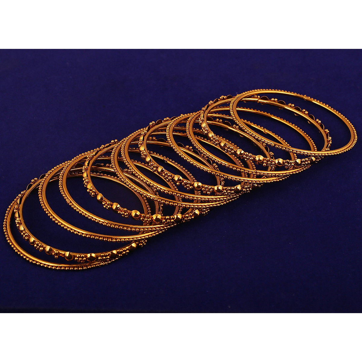 Touchstone "Golden Bangle Collection Indian Bollywood Ethnic Filigree with Modern Twist Charming Look Thick Designer Jewelry Bangle Bracelets Set of 4 for Women in Antique Gold tone.