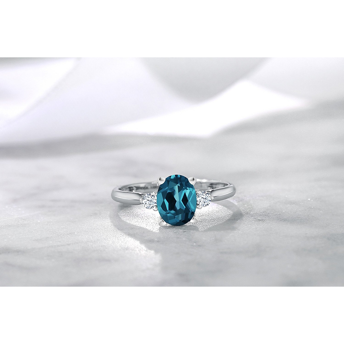 Gem Stone King 10K White Gold London Blue Topaz and White Created Sapphire 3-Stone Women's Ring (1.40 Cttw, Gemstone Birthstone, Available In Size 5, 6, 7, 8, 9)