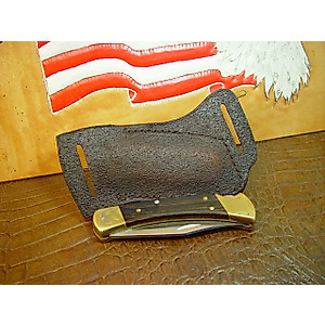 Custom left hand cross draw knife sheath for a buck 110 knife. The sheath is made out of buffalo hide leather hand tooled with a basket weave pattern.