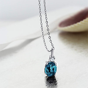 Gem Stone King 925 Sterling Silver London Blue Topaz and White Created Sapphire Pendant Necklace For Women (1.85 Cttw, Gemstone November Birthstone, Oval 9X7MM, with 18 Inch Silver Chain)