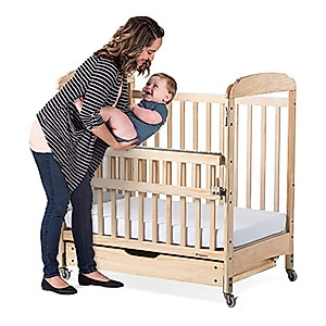 Foundations Serenity SafeReach Crib with Adjustable Mattress Board, Compact Baby Crib with Commercial Grade Casters, Clear End Panels for Child Visibility, Includes 3” Foam Mattress (Natural)