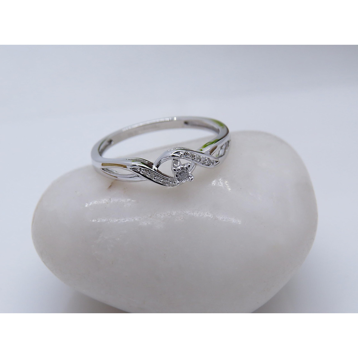 Dazzlingrock Collection Round White Diamond Crossover Swirl Promise Engagement Ring for Women (0.06 ctw, Color I-J, Clarity I2-I3) in 925 Sterling Silver Size 7