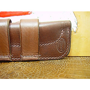 Custom Made Cross Draw Knife Sheath That Will fit The SOG Seal pup Light Brown. A lot of Leather for The Price and can be Worn on The Left or Right Hand Side. Sheath only.