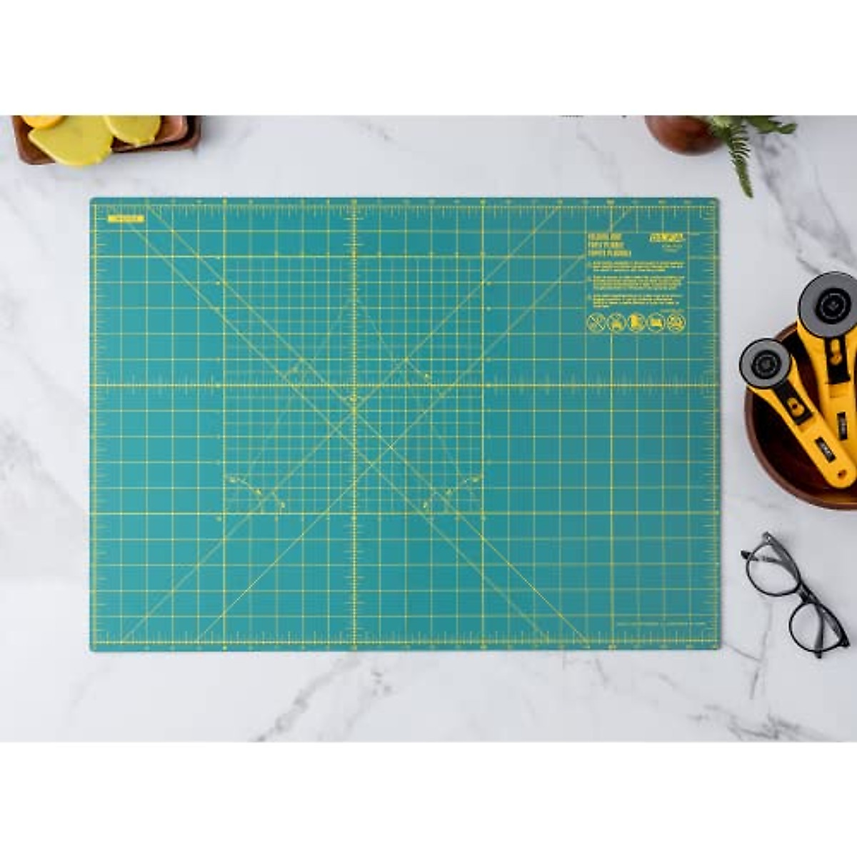 OLFA 17" x 24" Folding Cutting Mat (FCM-17x24) - Self Healing 17x24 Inch Foldable Rotary Mat with Grid for Quilting, Sewing, Fabric & Crafts, Use with Rotary Cutters & Fixed Blade Knives (Green)