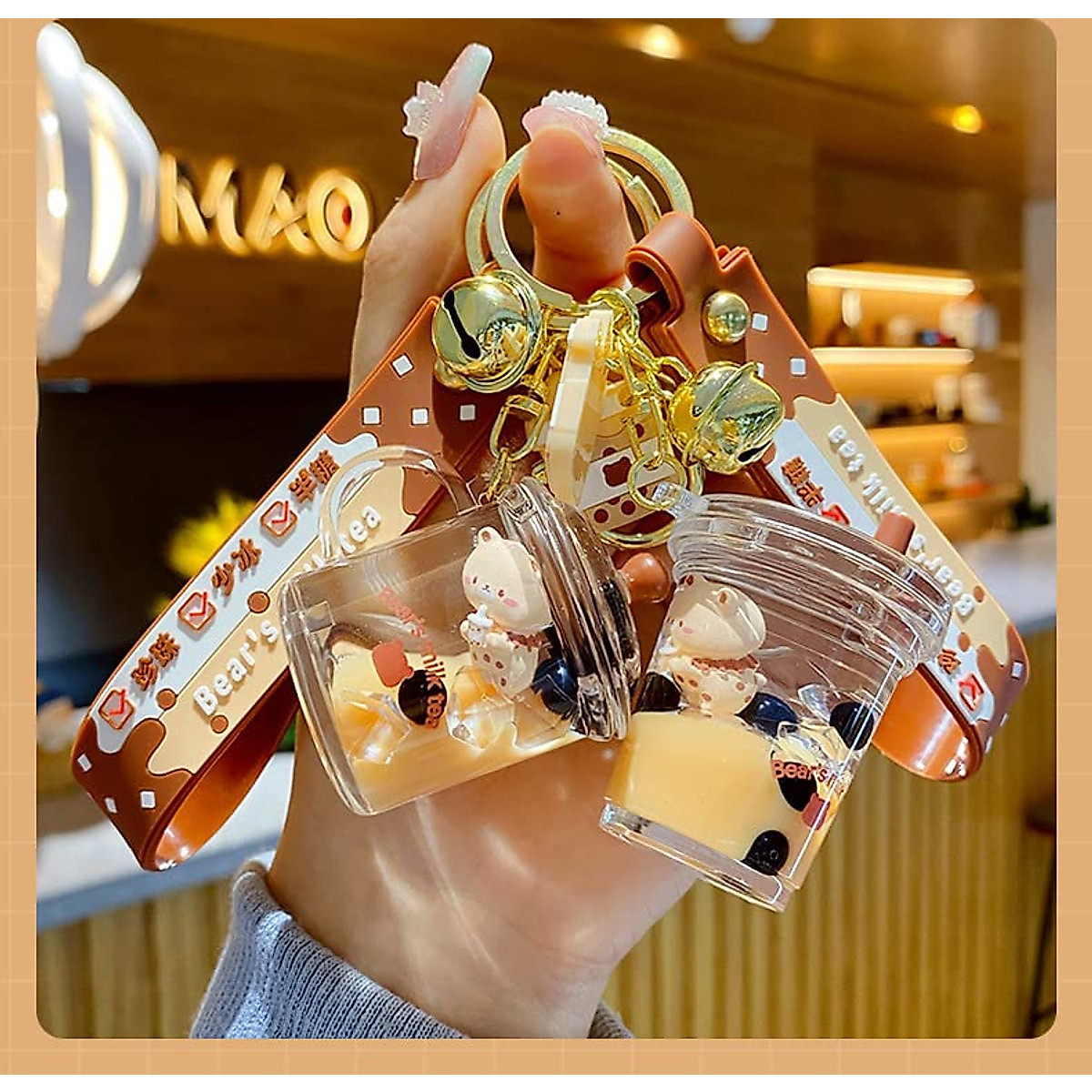 HSYHERE Men Women Creative Interesting Floating Milk Tea Brown Bear Lucky Bottle Keychain Keyrings, Bubble Moving Liquid Sand Car Chain Key Ring Bag Pendant Key Holder -Water Bottle