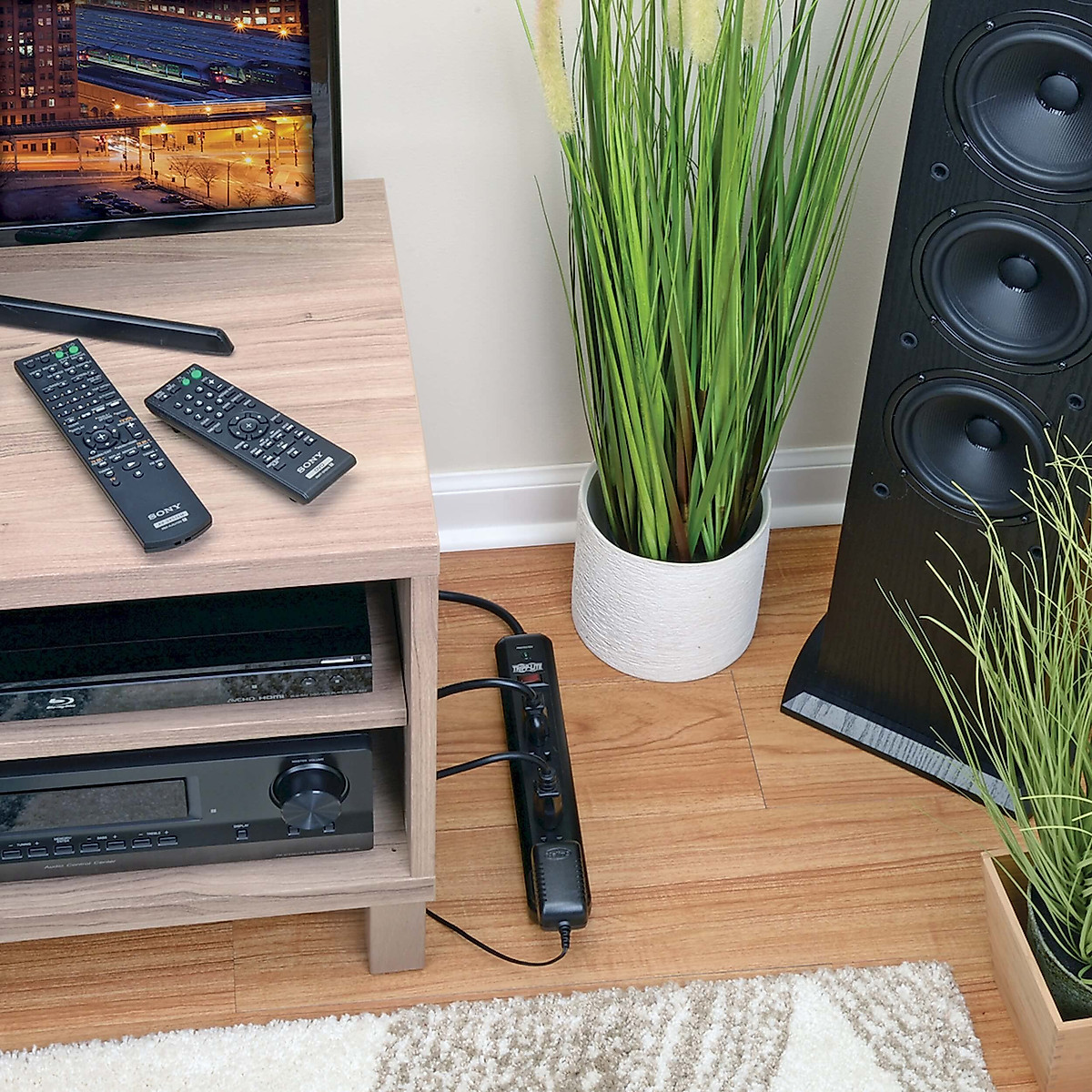 Tripp Lite 7 Outlet Surge Protector Power Strip, Extra Long 12ft Cord, Black, & Dollar 25,000 Insurance (TLP712B)