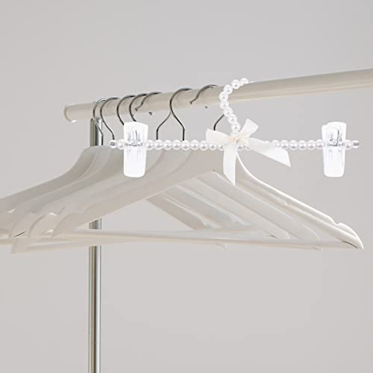 LUOZZY 2 Pcs Artificial Pearl Hangers Pearl Pants Hangers Plastic Bowknot Clothes Rack with Clip for Trousers Jeans Skirts