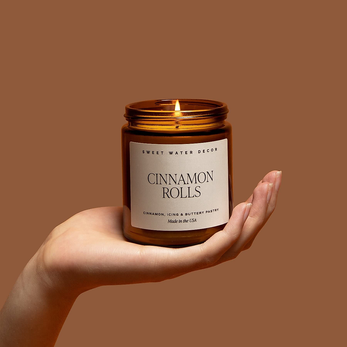 Sweet Water Decor Cinnamon Roll Candle - Christmas Candle with Cinnamon, Icing & Buttery Pastry for Home - Cinnamon Soy Candle with 40 Hours Burn Time - 9Oz Black Lid Amber Jar Cinnamon Scents