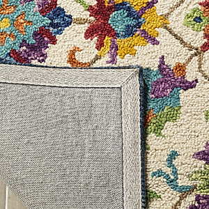 SAFAVIEH Aspen Collection Accent Rug - 2'3" x 5', Ivory & Blue, Handmade Boho Floral Wool, Ideal for High Traffic Areas in Entryway, Living Room, Bedroom (APN509A)