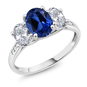 Gem Stone King 10K White Gold Blue Created Sapphire White Topaz and White Diamond Oval 3-Stone Engagement Ring For Women (2.60 Cttw, Gemstone September Birthstone, Available In Size 5, 6, 7, 8, 9)