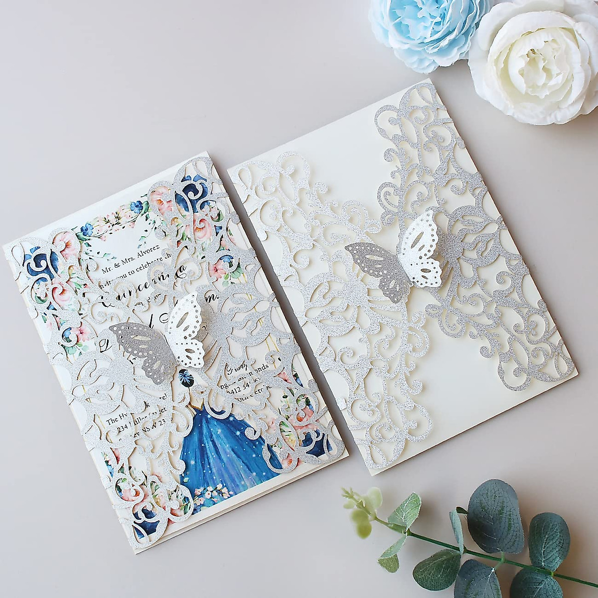 KUCHYNEE 20PCS 5.1x7.3 inch Silver Laser Cut Lace Flora Wedding Invitation Cards with Butterfly and Envelopes for Quinceañera Bridal Shower Wedding Invite (Silver Glitter)