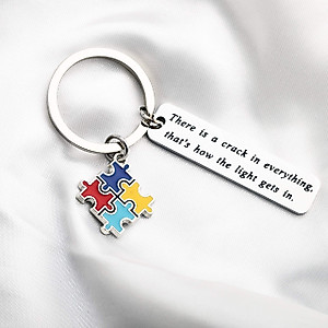 FUSTMW Autism Awareness Keychain Gift Puzzle Piece Charm Autism Mom Inspirational Gift for Autistic Teen There is a crack in everything that is how the light gets in (silver)
