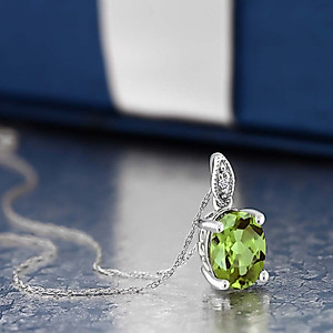Gem Stone King 10K White Gold Green Peridot and Diamond Pendant Necklace For Women (1.80 Cttw, Gemstone Birthstone, Oval 9X7MM With 18 Inch Chain)