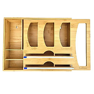 Redesigned and OVERSIZED ZipLock Bag storage organizer with plastic wrap and aluminum foil dispenser with cutter. 4 slots - Quart, Sandwich, Freezer and Gallon size.