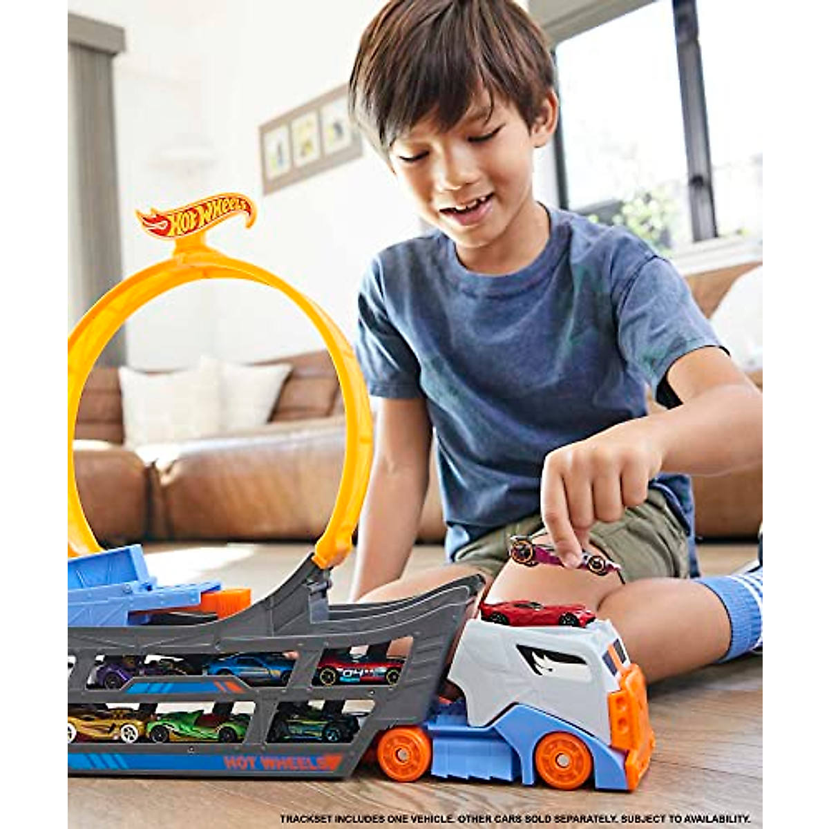 Hot Wheels Stunt & Go Track Set with 1 Toy Car, Transforming Hauler Truck with Launcher, Stores 18 1:64 Scale Cars [Amazon Exclusive]