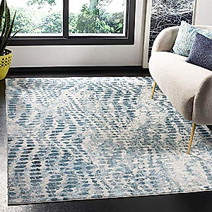 SAFAVIEH Aria Collection Area Rug - 5'1" x 7'6", Cream & Teal, Modern Boho Abstract Design, Non-Shedding & Easy Care, Ideal for High Traffic Areas in Living Room, Bedroom (ARA121A)