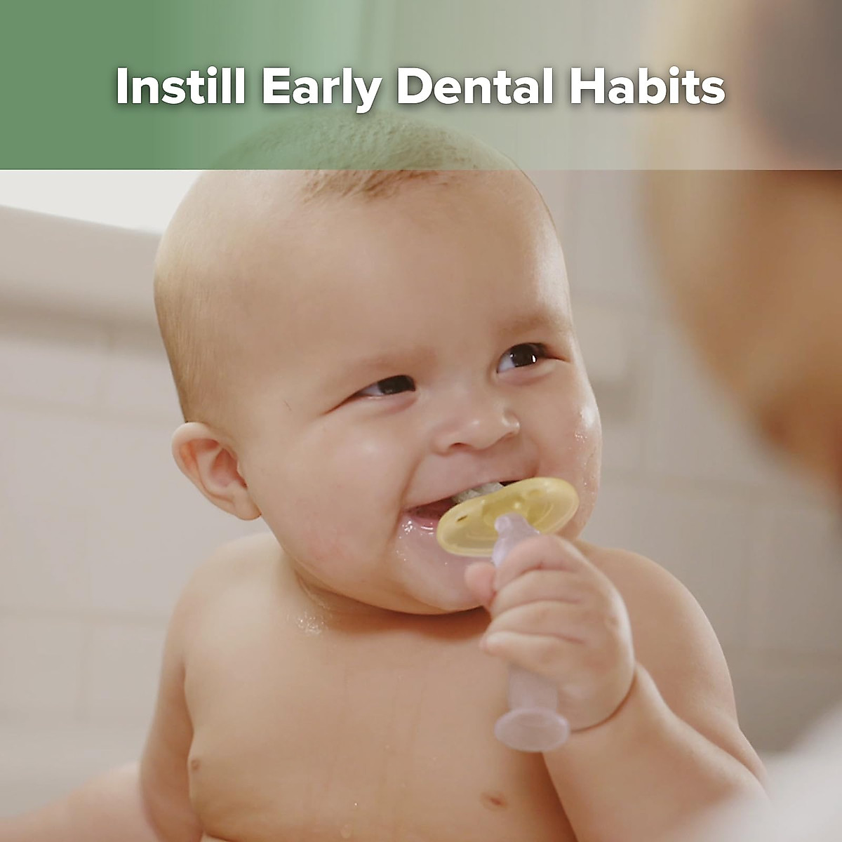 haakaa 360° Baby Toothbrush with Suction Base - Gentle Cleaning for Infant Self-Brushing Training, Food-Grade Silicone, Adjustable Safety Shield - Translucent (1 Piece)