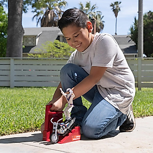 Evel Knievel Stunt Cycle - The Amazing Wind Up and Go Action Toy Launcher for Ultimate Jumps, Crashes, Flips and More - 8 Inch Bike Jumps Anywhere from 3 to 10 Feet - Original 1970's