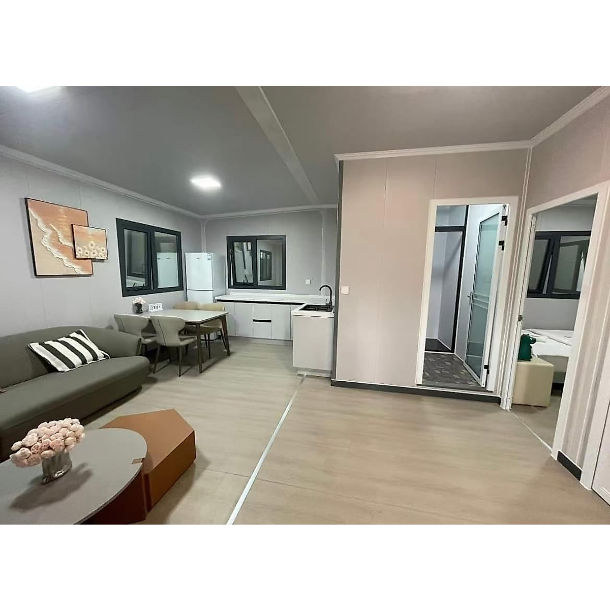 Prefabricated Modular Home with 2 Bedrooms, 1 Kitchen with Well furnished, 1 Bathroom with Exhaust Fan, 1 Living Room with Windows and Glass Doors, Sections