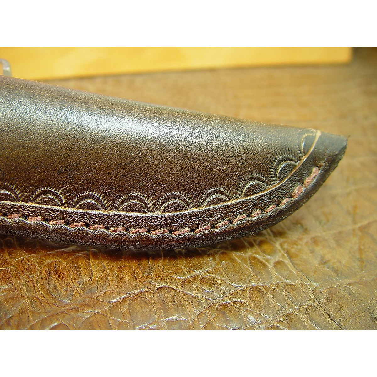 Custom Leather Vertical Knife Sheath. The Sheath Is Made Out of 10 Ounce Water Buffalo Hide Leather with a Border Tooling Dyed Dark Brown. The Sheath Is Made Out of Water Buffalo Leather the Water Buffalo Leather Is Very Soft Pliable and Durable. The Shea