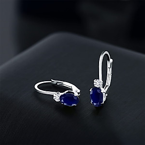 Gem Stone King 14K White Gold Blue Sapphire and White Diamond Leverback Earrings For Women | 1.17 Cttw | Gemstone September Birthstone | Oval 6X4MM, Round 2MM | 3/4 Inch