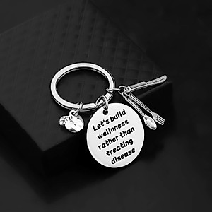 TGBJE Nutritionist Gift Keychain - 'Let's Build Wellness' Stainless Steel Keychain, Perfect for Dietitians, Nutrition Graduates & RDNs - Silver, Unisex, 3.0x3.0cm - Includes Velvet Pouch