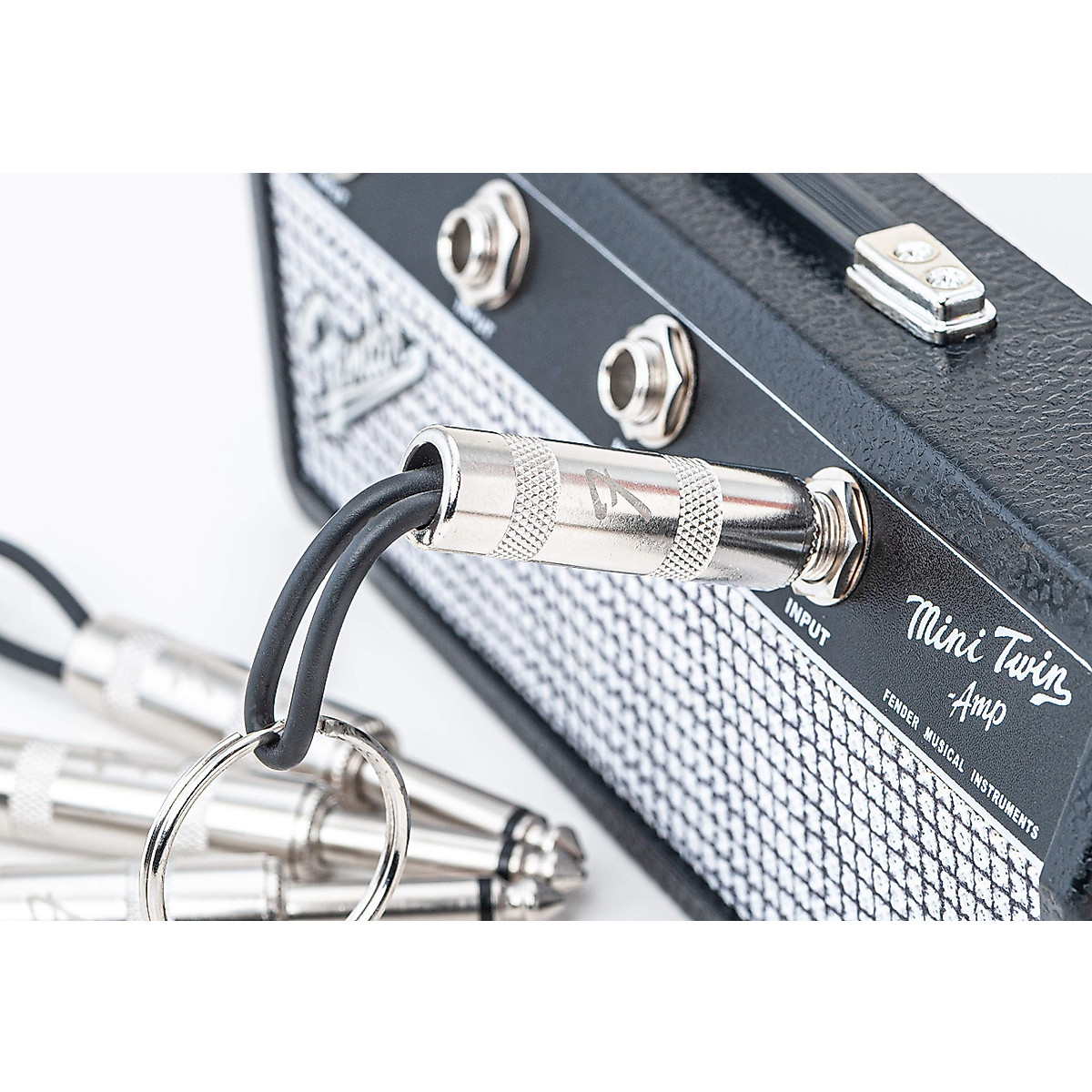 Licensed Fender Jack Rack- guitar amp key holder, includes 4 guitar plug keychains and 1 wall mounting kit. Quick and easy installation.
