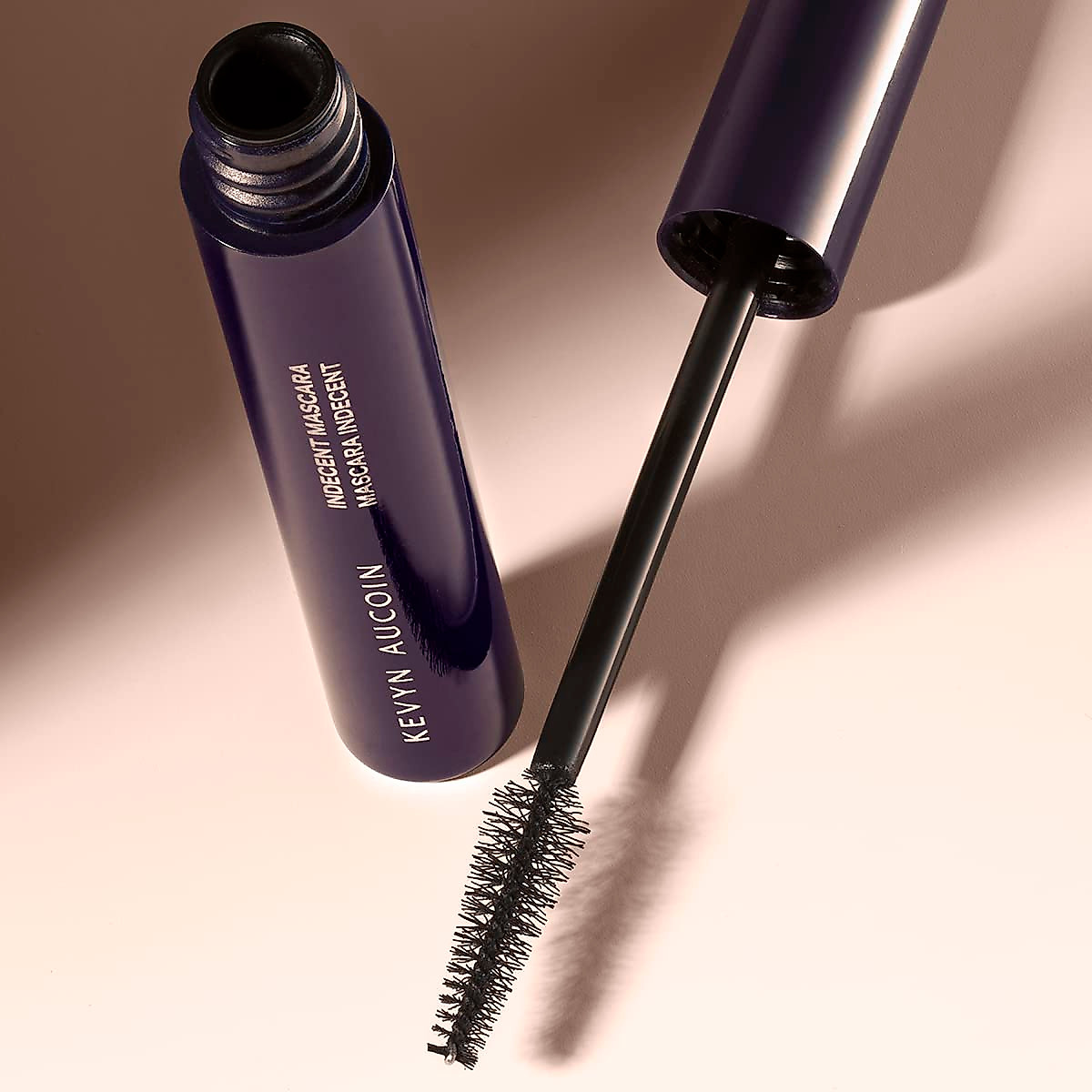 Kevyn Aucoin Indecent Mascara, Black: Thin cone-shaped brush. Creamy lash condition formula. Dramatic and natural look. Long wear. Clump & flake-free. Pro makeup artist go to for defined fuller lashes