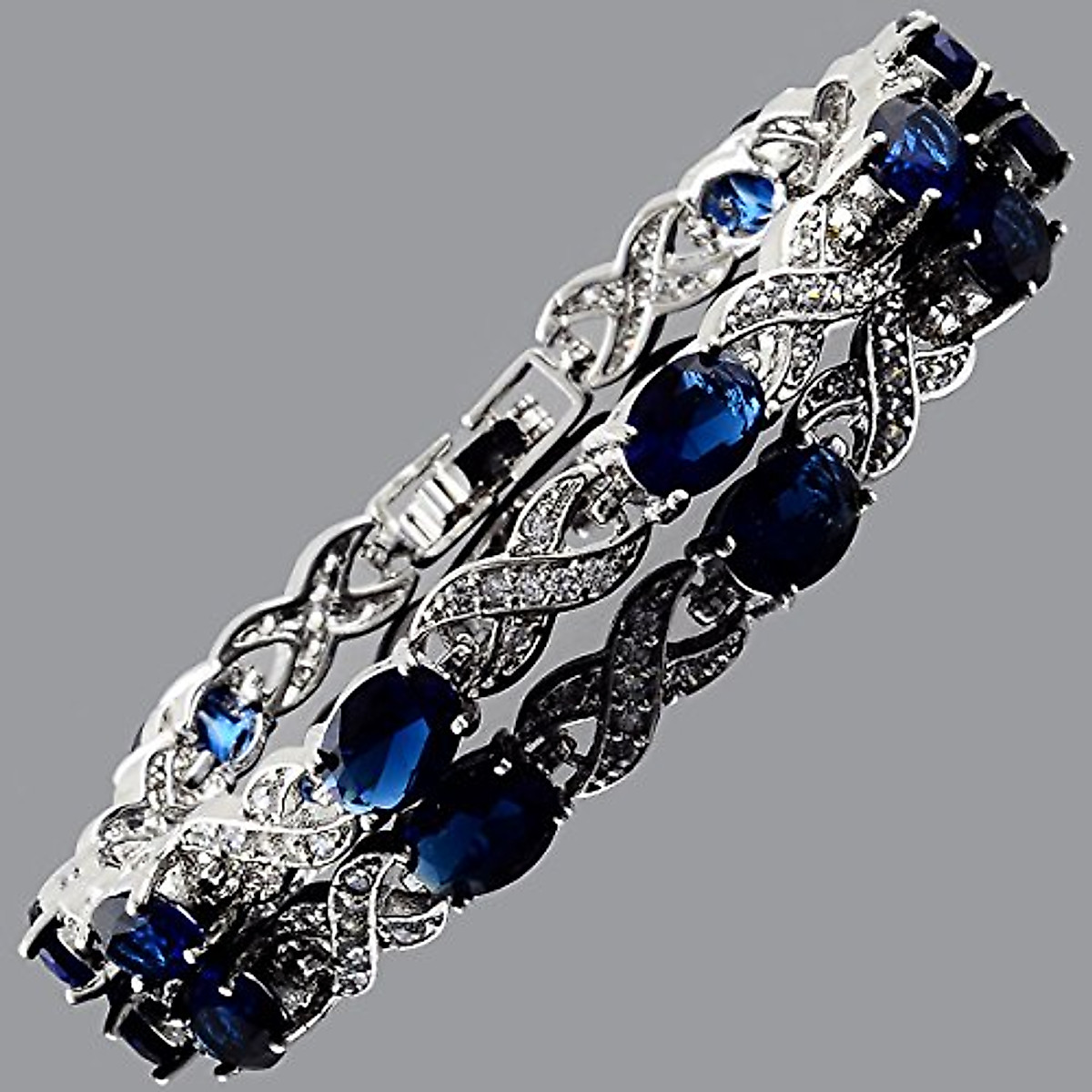 RIZILIA Tennis Bracelet & Oval Cut CZ [Simulated Blue Sapphire] in White Gold Plated, 7"