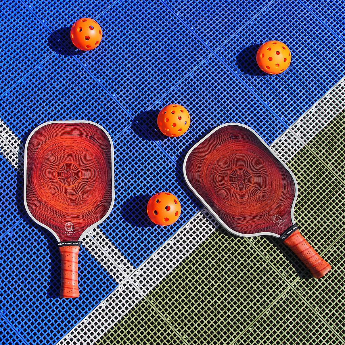 A. Anbrose Pickleball Paddle Set (Walnut) | Comfort Cushion Grip | Long Handle | Fiberglass | Polypropylene Honeycomb Core | 2 Racquets | 4 Pickleballs(2 Indoor 2 Outdoor) | 1 Portable Bag